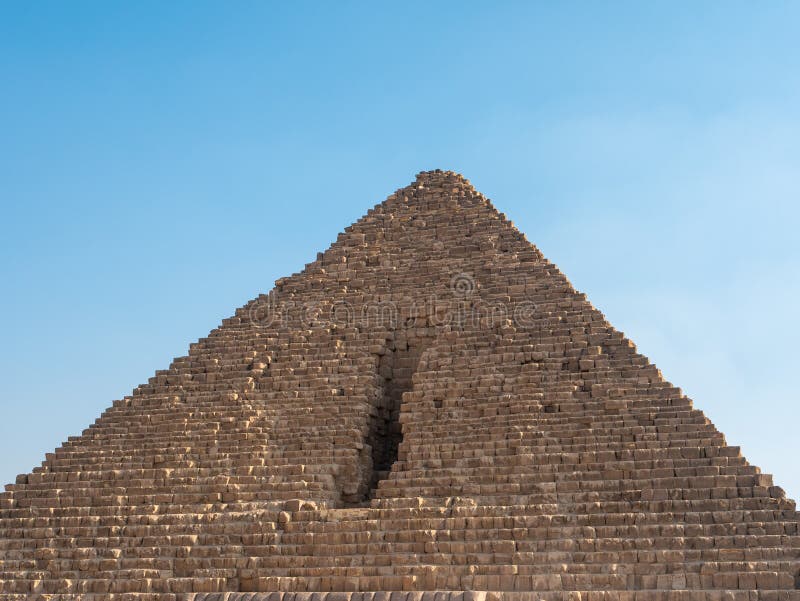 Egyptian Pyramid Made of Stone Blocks Against the Blue Sky. Close-up ...