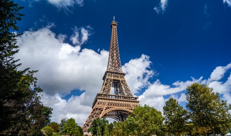 Eiffel Tower with Clouds on a Sunny Day in Paris Stock Photo - Image of ...