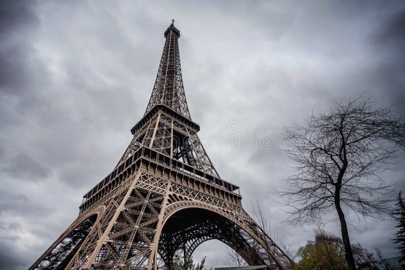 The Eiffel Tower with Gray Sky and Clouds in Paris, France Stock Photo ...