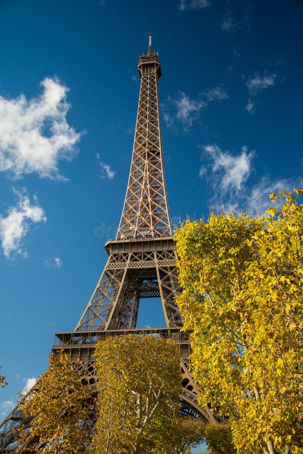 Eiffel Tower Over Blue Sky and Fall Leaves Stock Photo - Image of blue ...
