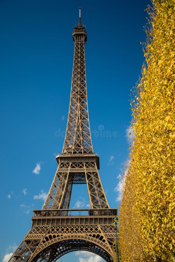 Eiffel Tower Over Blue Sky and Fall Leaves Stock Photo - Image of ...