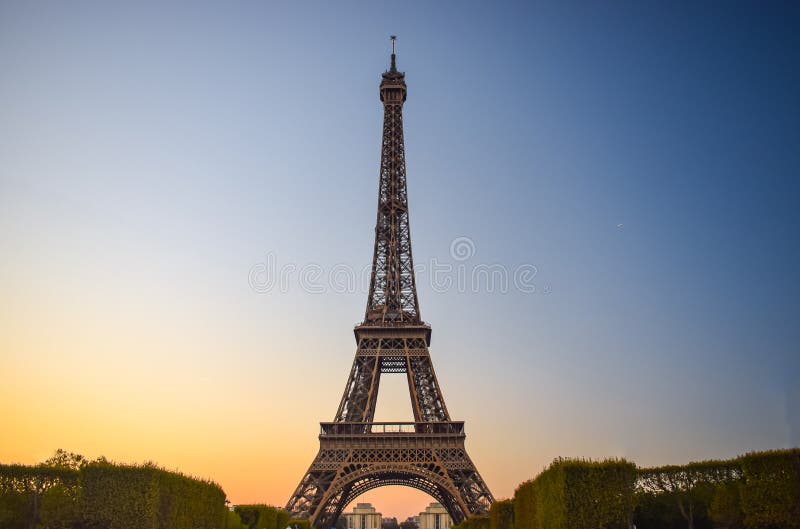 Eiffel Tower in Paris at Sunset with Blue and Yellow Sky Stock Image ...