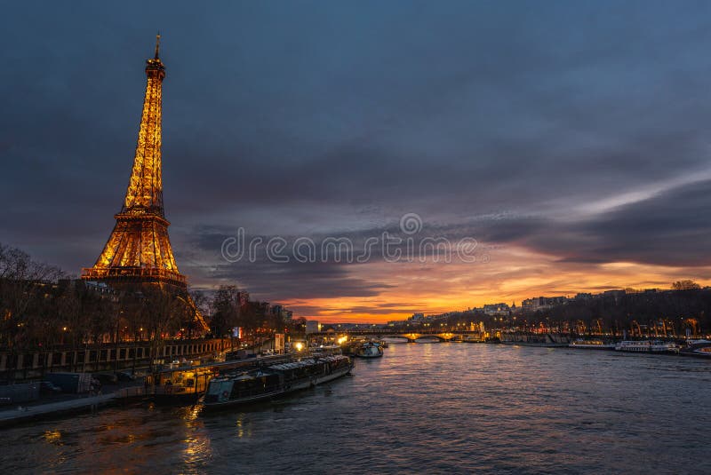 Eiffel Tower at Sunset, with the Parisian Cityscape in the Background ...