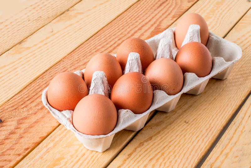Eight Eggs in Box on a Wooden Table. Stock Photo - Image of wood ...