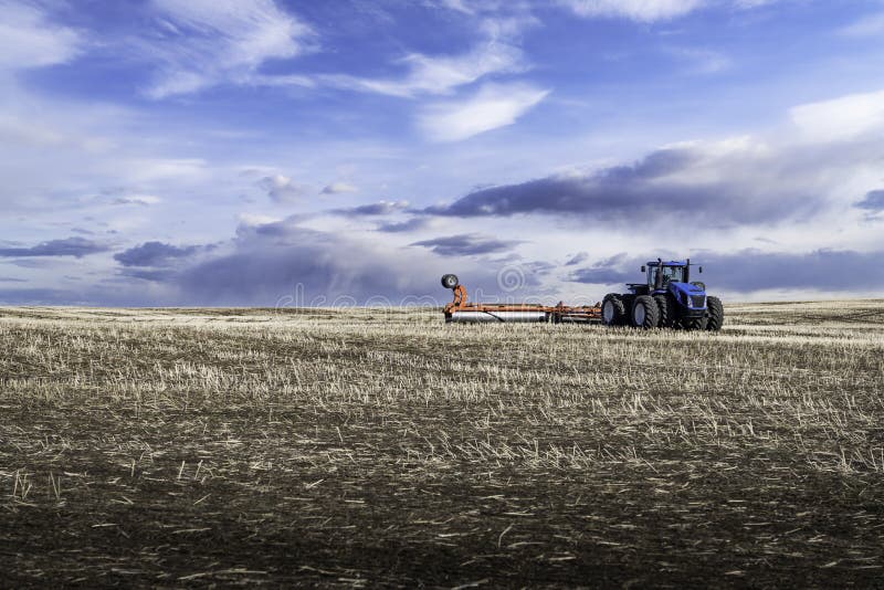Eight Wheel Tractor Pulling a Plow Across a Tilled Field Stock Image ...