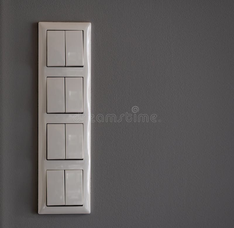 Eight White Light Switches on a Grey Wall. Stock Photo - Image of ...
