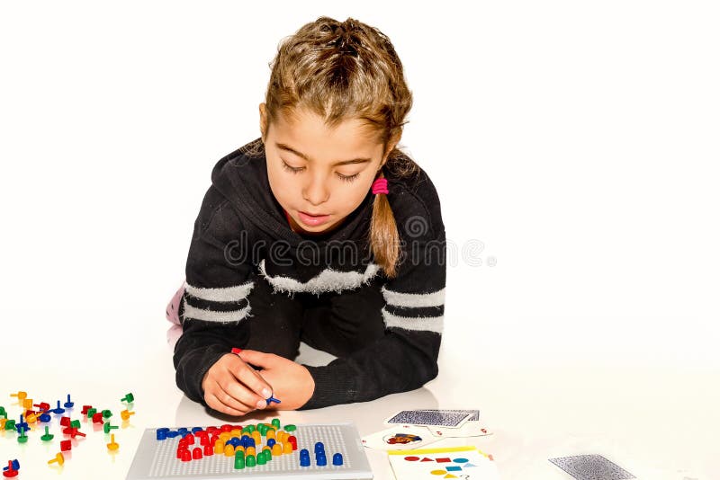 Eight Year Old Girl Playing with Board Game on White Stock Image ...