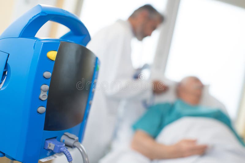 Ekg Machine with Patient and Doctor in Background Stock Image - Image ...