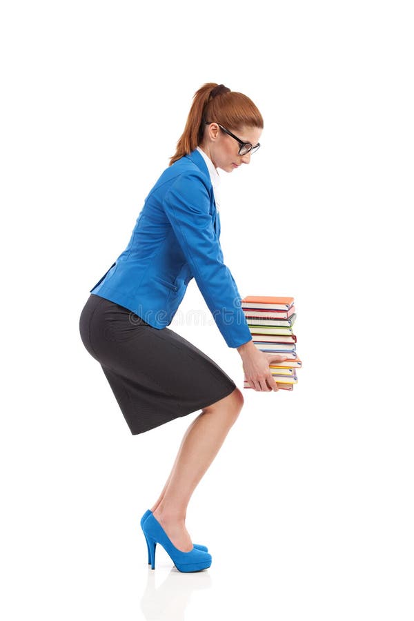 El Agacharse Con La Pila Pesada De Libros Imagen de archivo - Imagen de ...