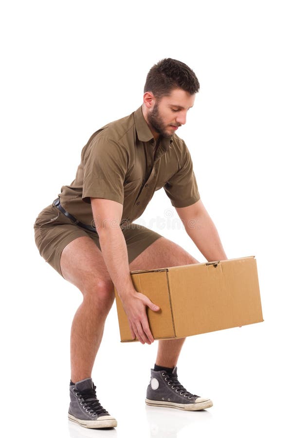 El Agacharse Con Un Paquete Pesado Imagen de archivo - Imagen de ...