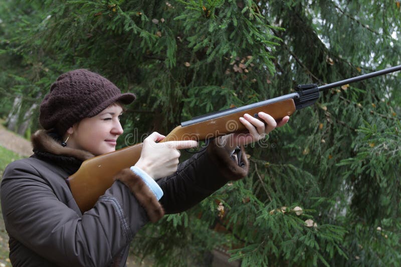 El apuntar de la mujer foto de archivo. Imagen de juego - 6854796