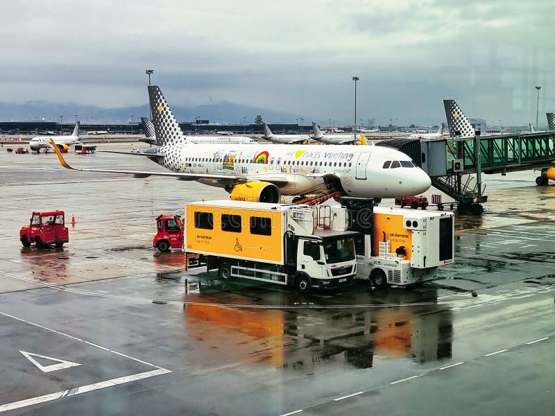 Planes and Vehicles at the Barcelona Airport, Named Josep Tarradellas ... Planes and Vehicles at the Barcelona Airport, Named Josep Tarradellas ...