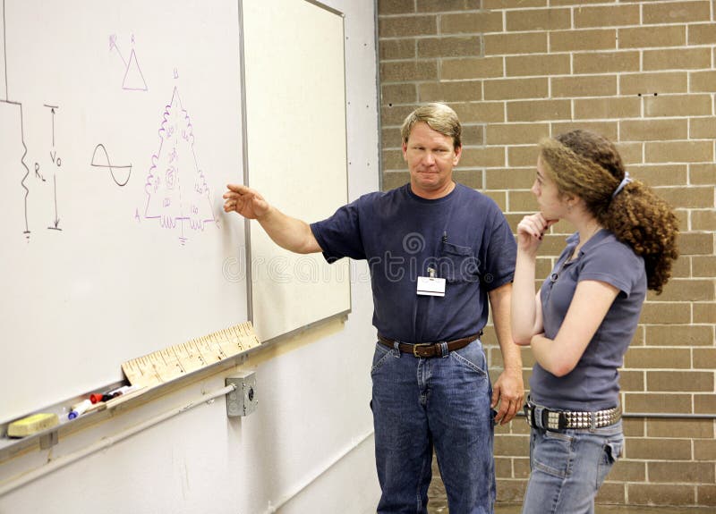 El Profesor Explica Al Estudiante Imagen de archivo - Imagen de gente ...