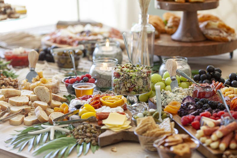 Elaborate Charcuterie Table Set Up with Meats, Bread, Cheese, Nuts, and ...