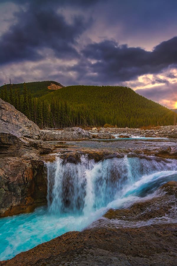 Elbow Falls Under a Sunrise Sky Stock Photo - Image of flowing ...