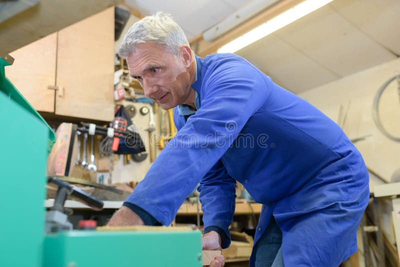 Elder Carpenter Working in Workshop Wearing Work Clothes Stock Photo ...