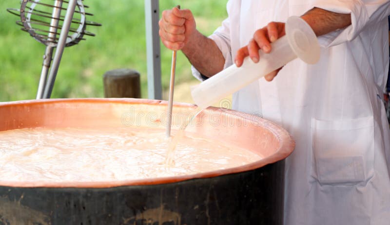 Elder Cheesemaker Pours Milk Rennet in Copper Pot for Making Che Stock ...
