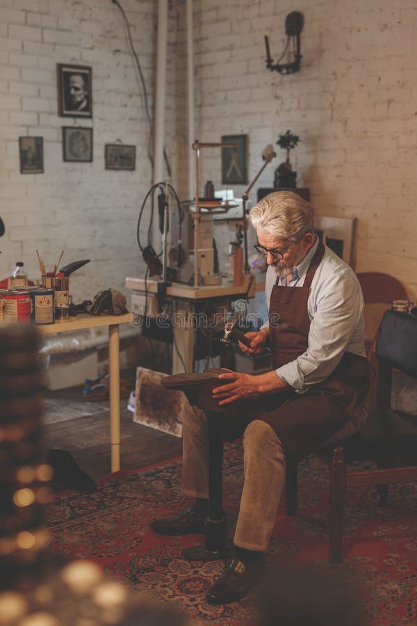 Old Cobbler Workshop with Shoes, Hammer and Nails Stock Photo - Image ...