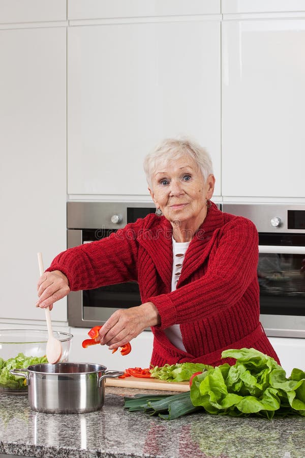 Lady cooking stock image. Image of blond, holding, modern - 8870517
