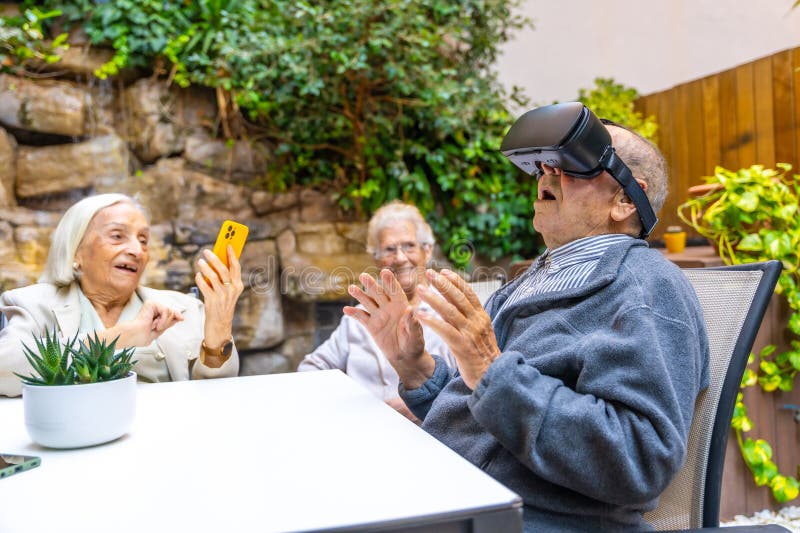 Elder Man Using Virtual Reality Goggles in a Nursing Home Stock Image ...