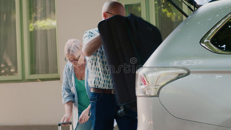 Elder People Loading Vehicle with Baggage and Trolleys Stock Video ...