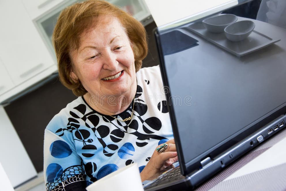 Elder Woman with a Computer Stock Photo - Image of laptop ...