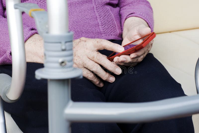 Elder Woman with a Smartphone and Orthopedic Walker Stock Photo - Image ...