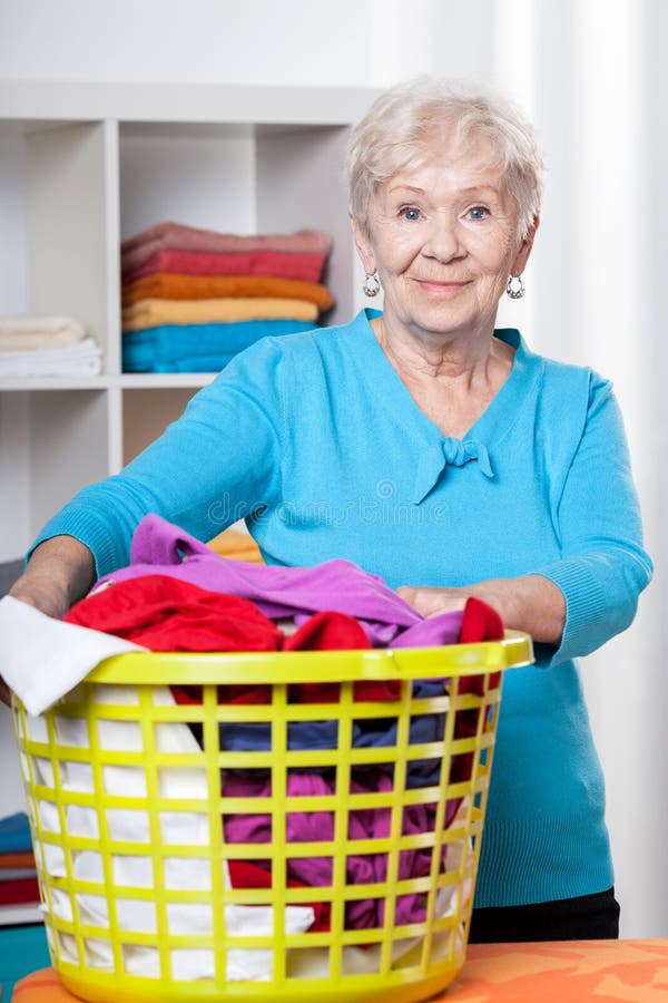 Elderdly lady with washing stock image. Image of clothes - 38383221