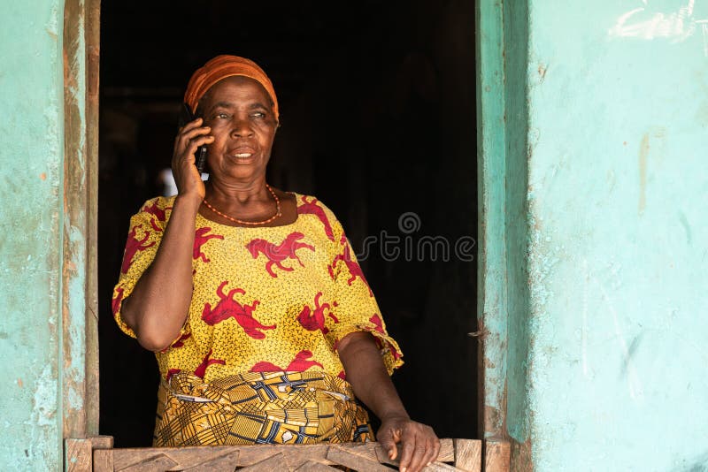 An Elderly African Woman Making a Phone Call Stock Image - Image of ...