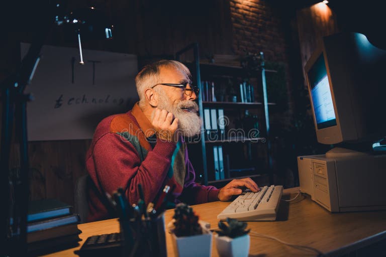 Elderly Bearded Programmer Coding on a Vintage Computer while Working ...