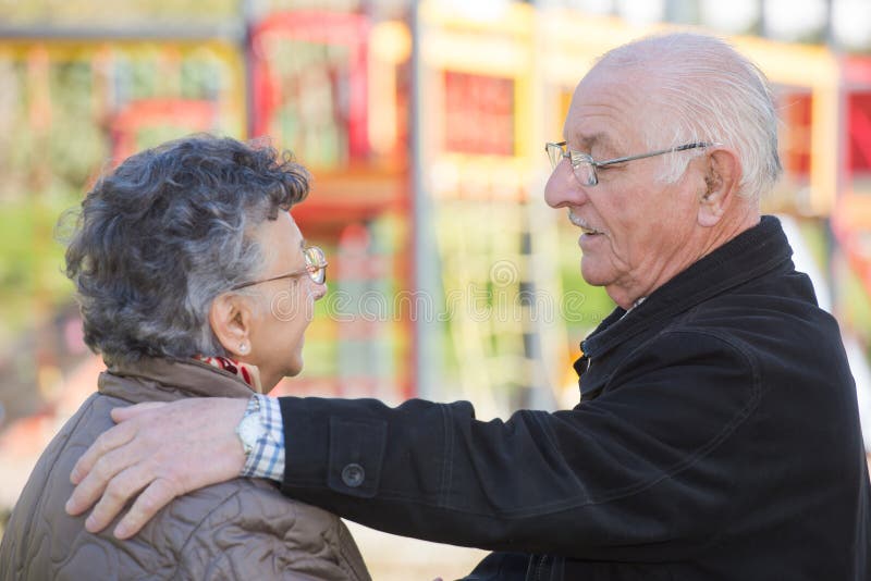 Elderly Couple Deep in Conversation Stock Image - Image of shoulder ...
