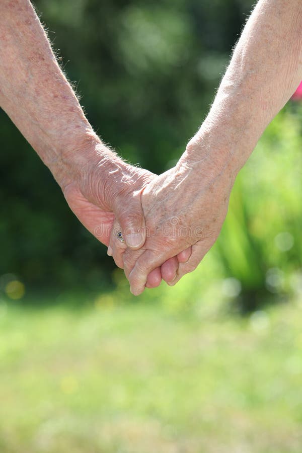 Elderly Couple Holding Hands Stock Image - Image of senior, woman: 15453873