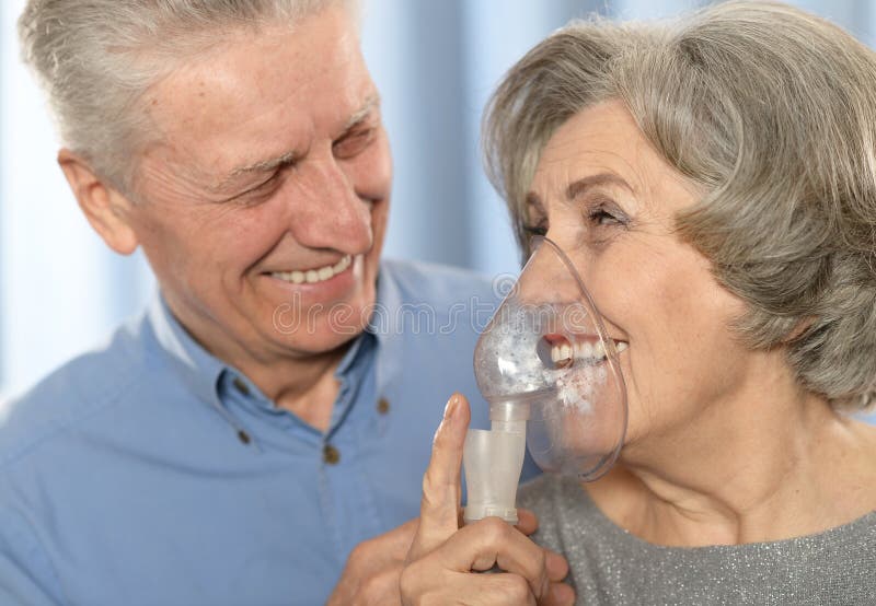 Elderly Couple with Inhaler Stock Photo - Image of bronchial, nebuliser ...