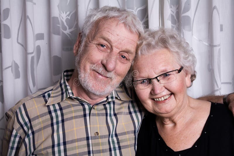Elderly couple posing stock image. Image of female, glasses - 5556435