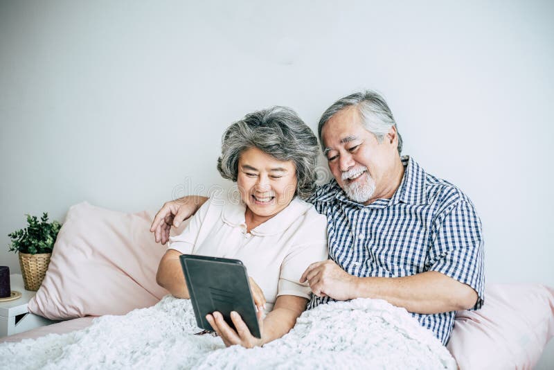 Elderly Couple Tablet Computer Stock Photo - Image of cheerful ...