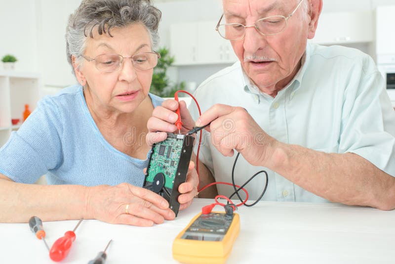 Elderly Couple Reading Newspaper Stock Image - Image of retired ...