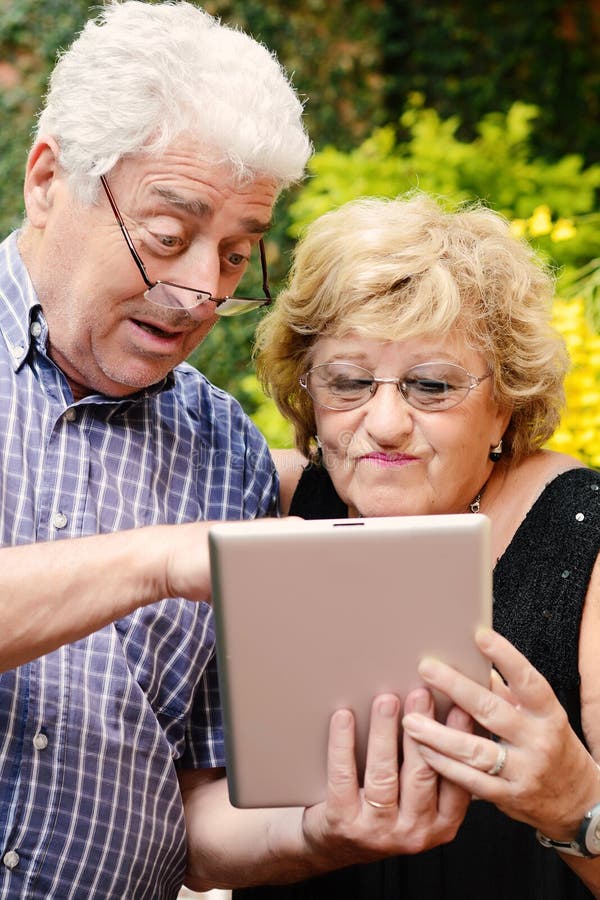 Elderly Couple Using Tablet. Stock Image - Image of internet ...
