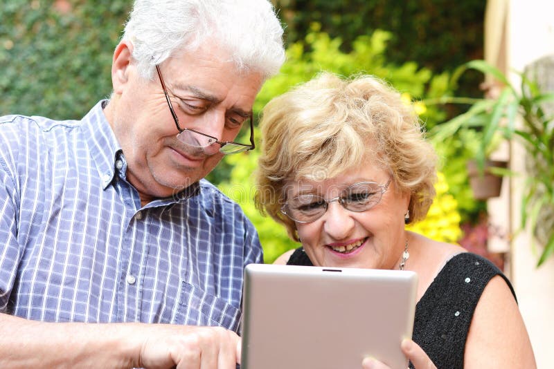 Elderly Couple Using Tablet. Stock Image - Image of relaxed, computer ...