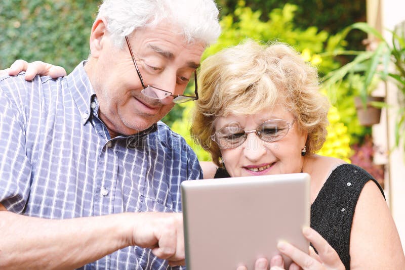 Elderly Couple Using Tablet. Stock Image - Image of leisure, retired ...