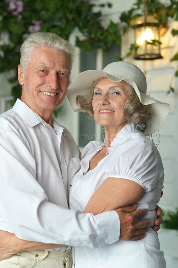 Elderly couple on veranda stock photo. Image of female - 42904310