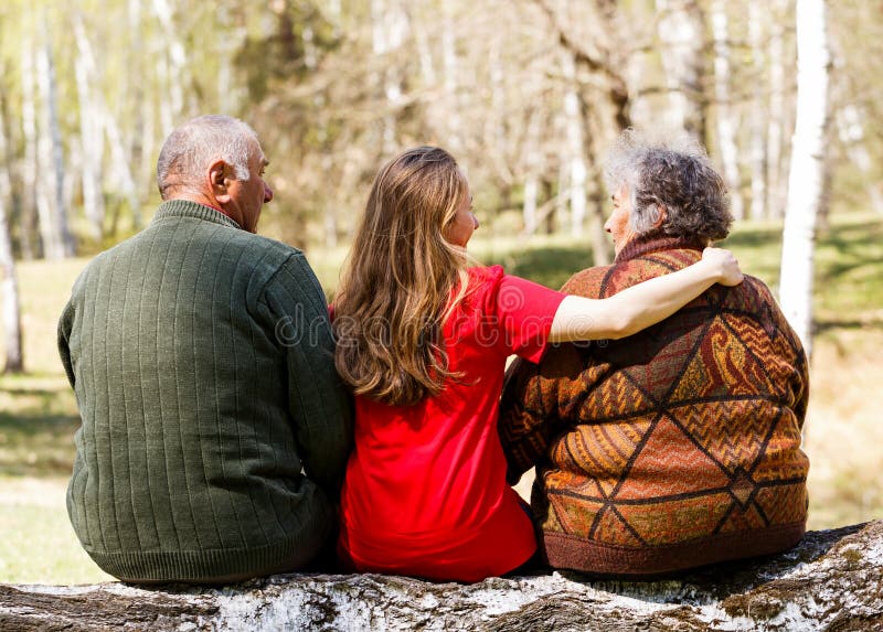 Elderly Couple and Young Caregiver Stock Photo - Image of caring ...