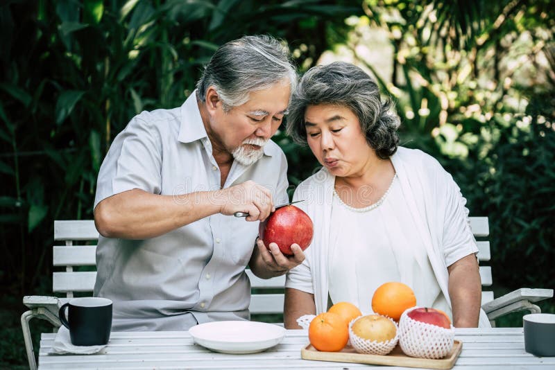 Elderly Couples Eating Some Fruit Stock Photo - Image of countryside ...