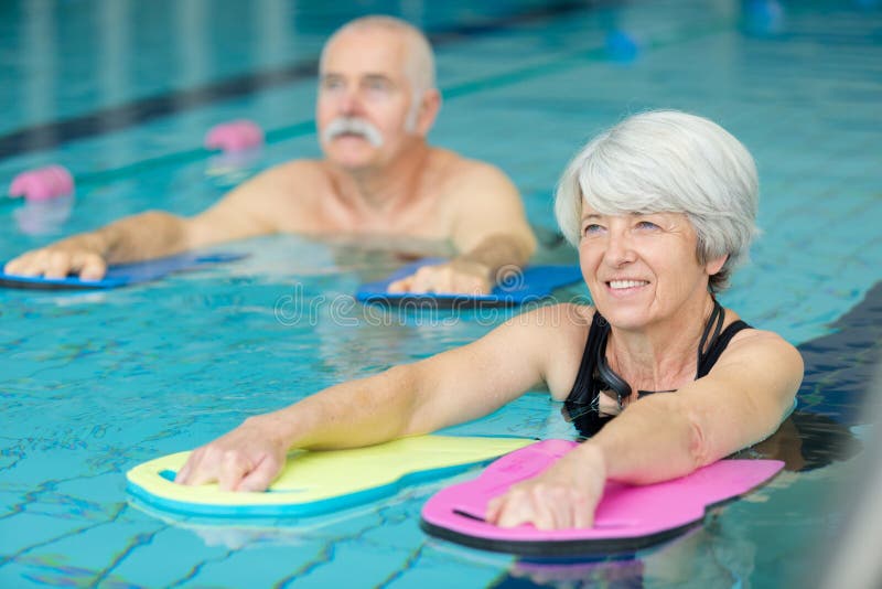 Elderly Doing Aqua Exercises in Pool Stock Image - Image of male ...