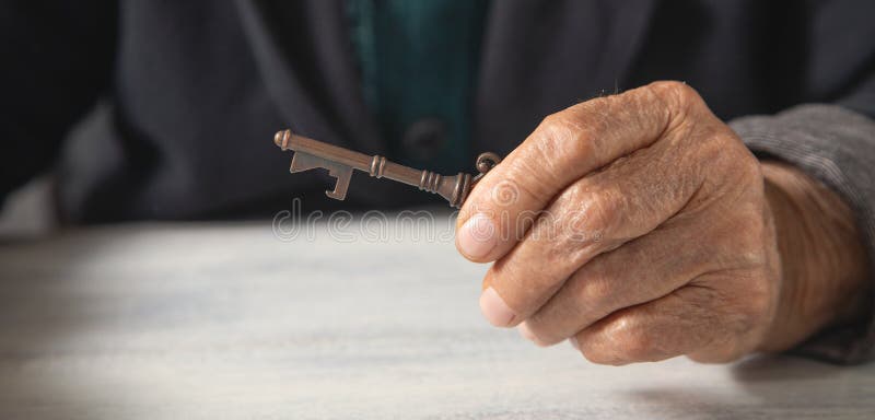 Elderly Female Hand with a Old Key Stock Photo - Image of business ...