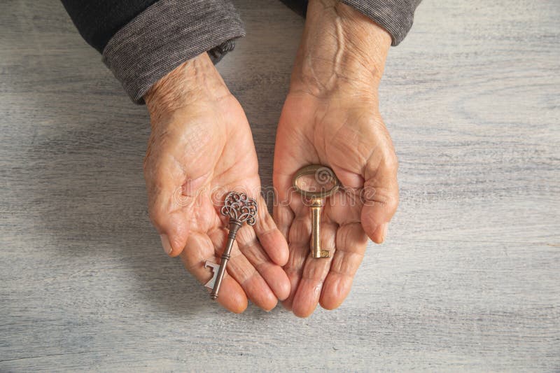 Elderly Female Hand with a Old Key Stock Photo - Image of woman ...