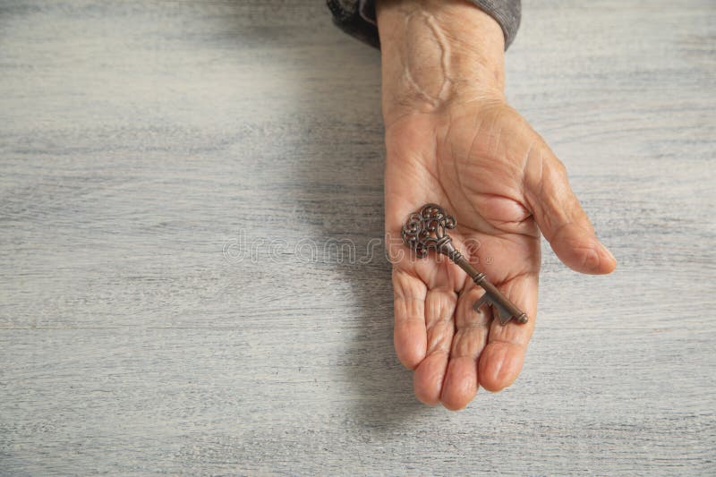 Elderly Female Hand with a Old Key Stock Image - Image of woman, estate ...