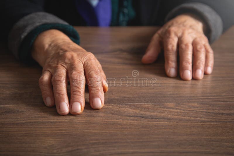 Elderly Female Hand on the Table Stock Image - Image of table ...