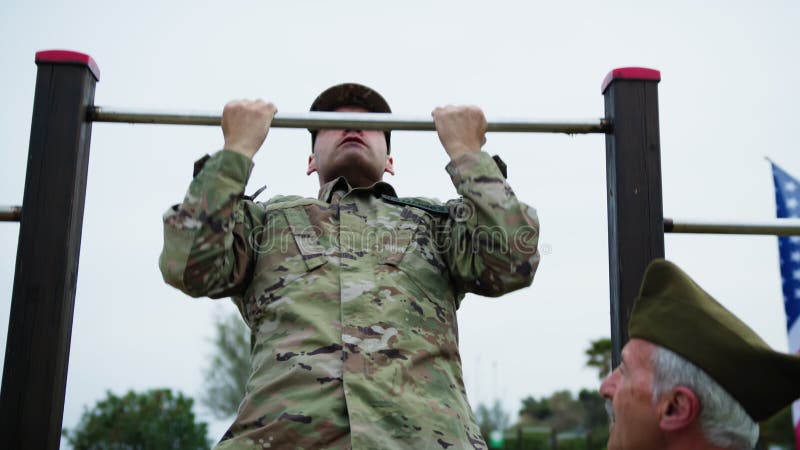 Elderly General Checks the Physical Strength of the Military Cadet with ...