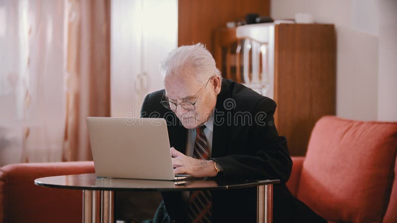 Elderly Grandfather - Old Grandfather is Typing Something Hunched Over ...
