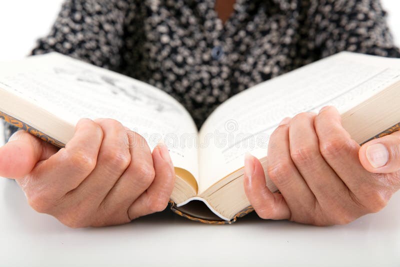 The Elderly are Holding a Book and Reading Carefully Stock Photo ...